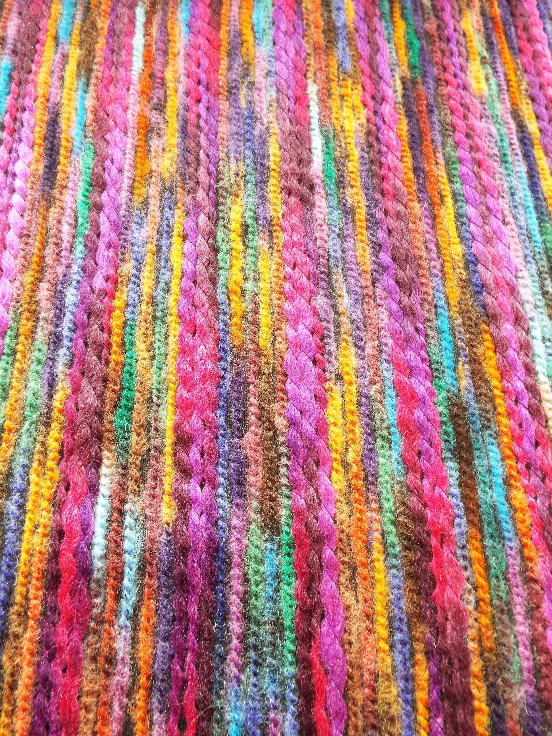 Twisted wool effect coating on a felted backing